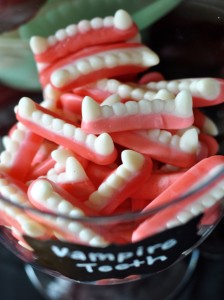 Vampire teeth candy in an apothecary jar for Halloween - Make Life Lovely