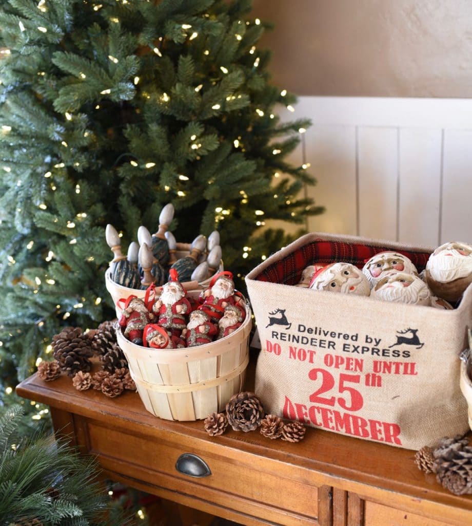 Decorating the Christmas tree at a tree trimming party - Make Life Lovely