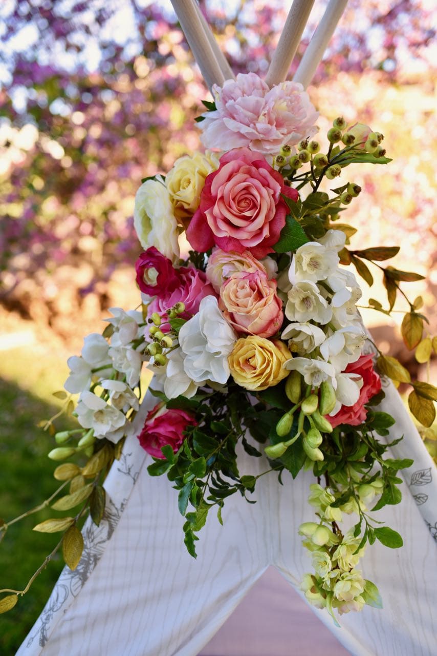 Bohemeian teepee with flowers at boho party - Make Life Lovely